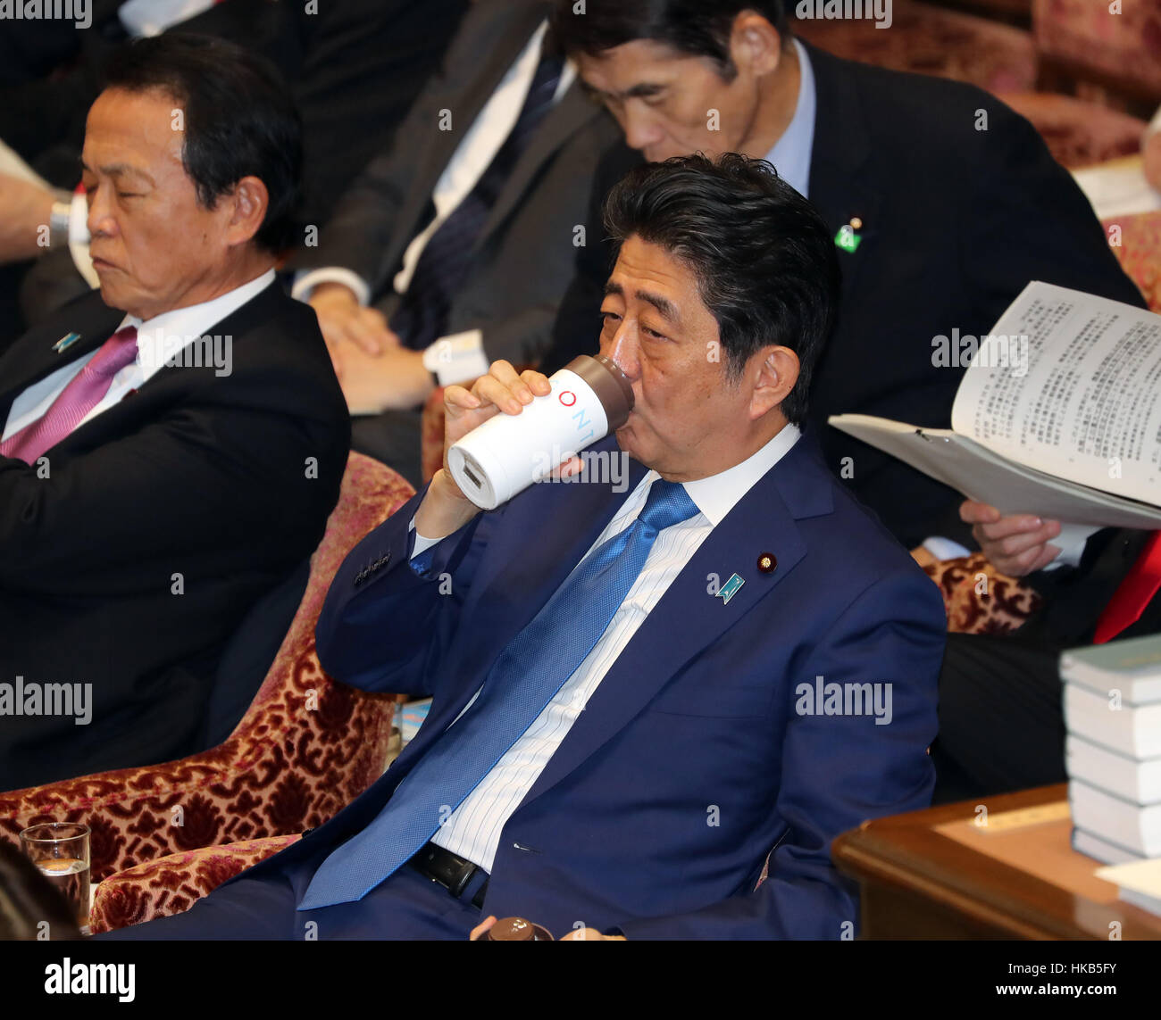 Tokyo, Japan. 26th Jan, 2017. Japanese Prime Minister Shinzo Abe drinks ...