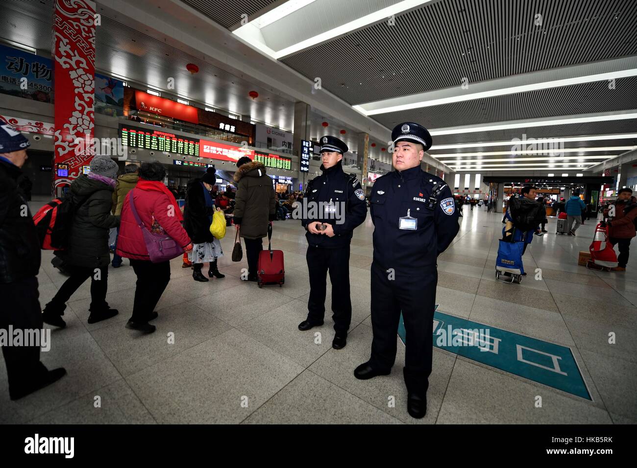 Changchun, China. 26th Jan, 2017. Police officers Gao Yang (C-R) and ...