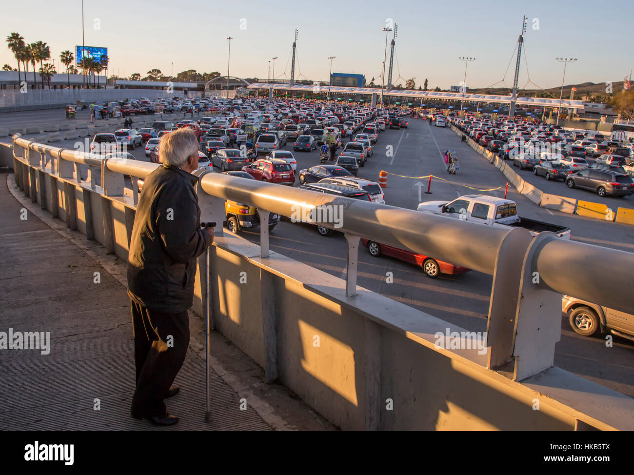 Tijuana, Mexico. 25th Jan, 2017. Image shows a man watching cars ...