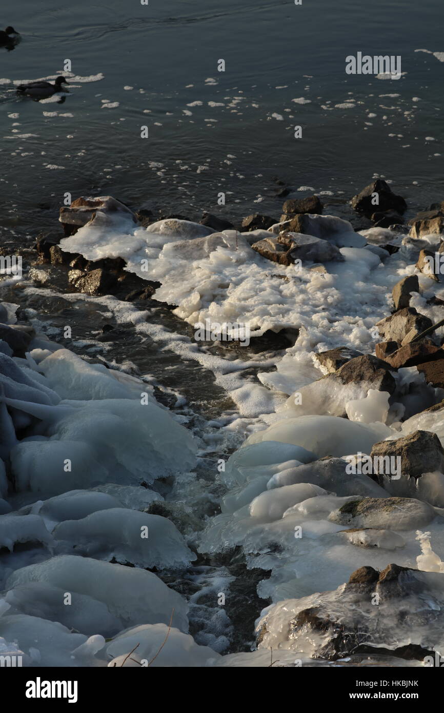 Frozen River in a winter landscape Stock Photo - Alamy