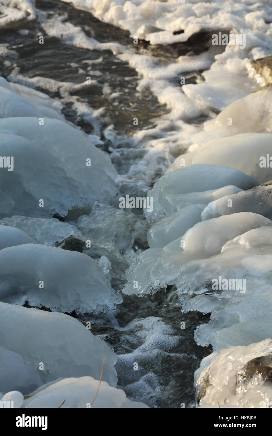 Frozen River in a winter landscape Stock Photo - Alamy
