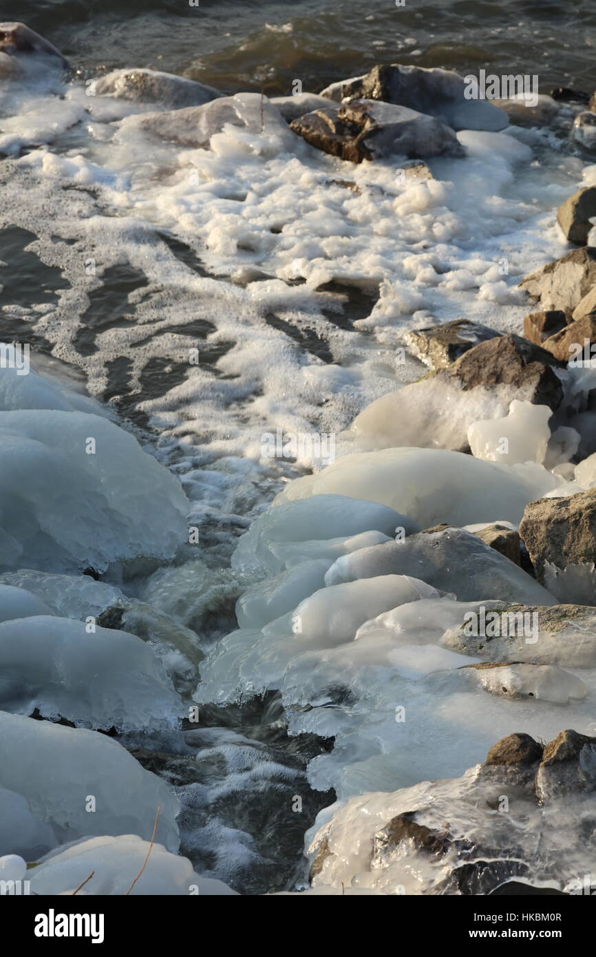 Frozen River in a winter landscape Stock Photo - Alamy