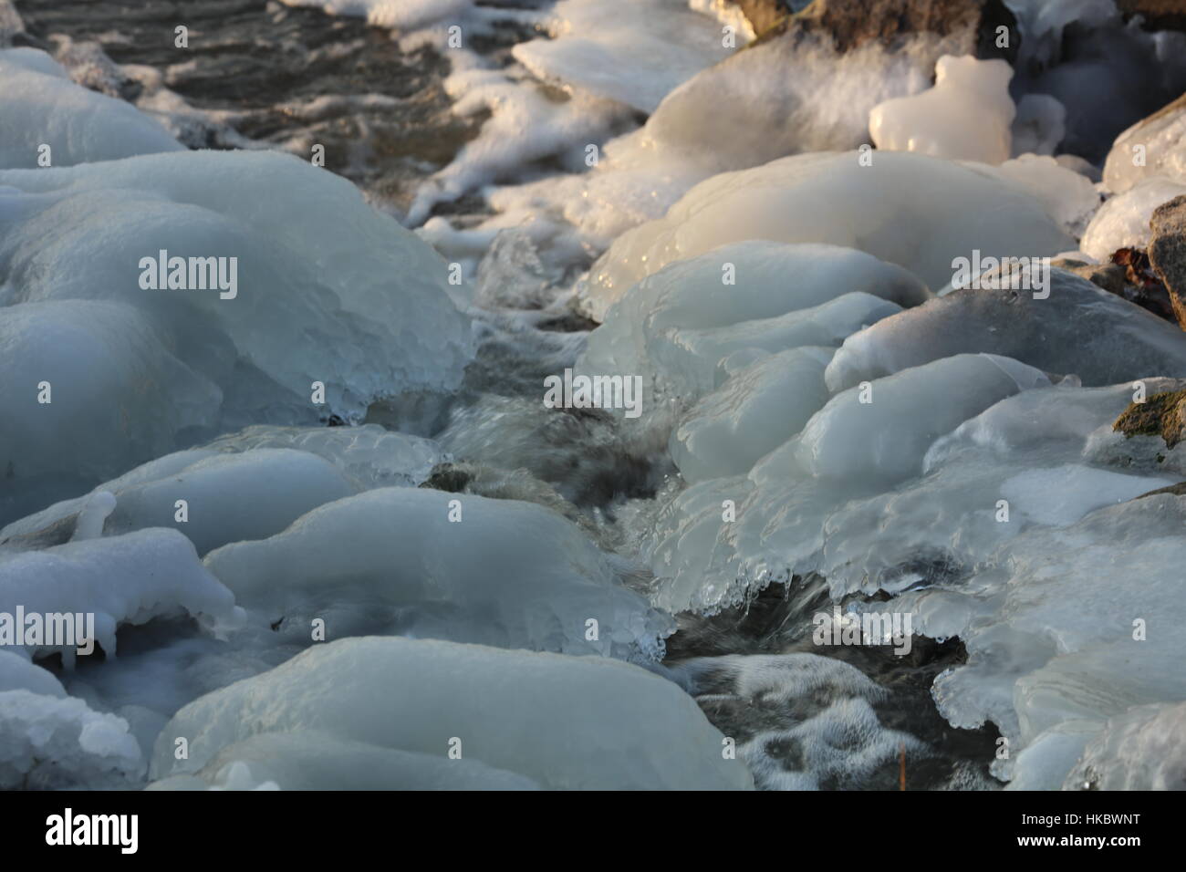 Frozen River in a winter landscape Stock Photo - Alamy