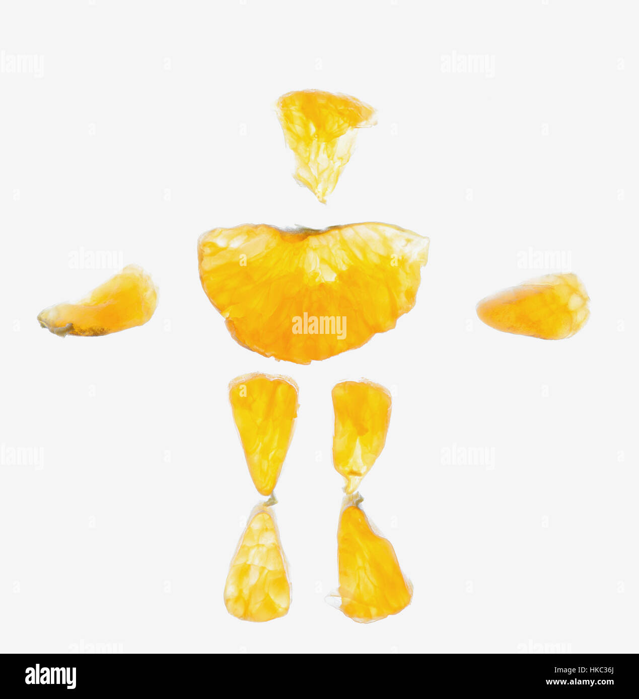 Mandarines slices on white background in human shape Stock Photo - Alamy