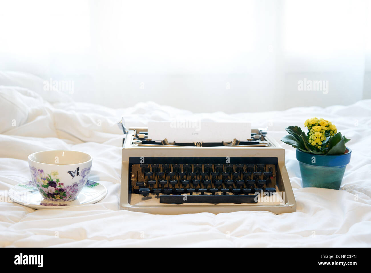 Vintage typewriter on the bed Stock Photo - Alamy