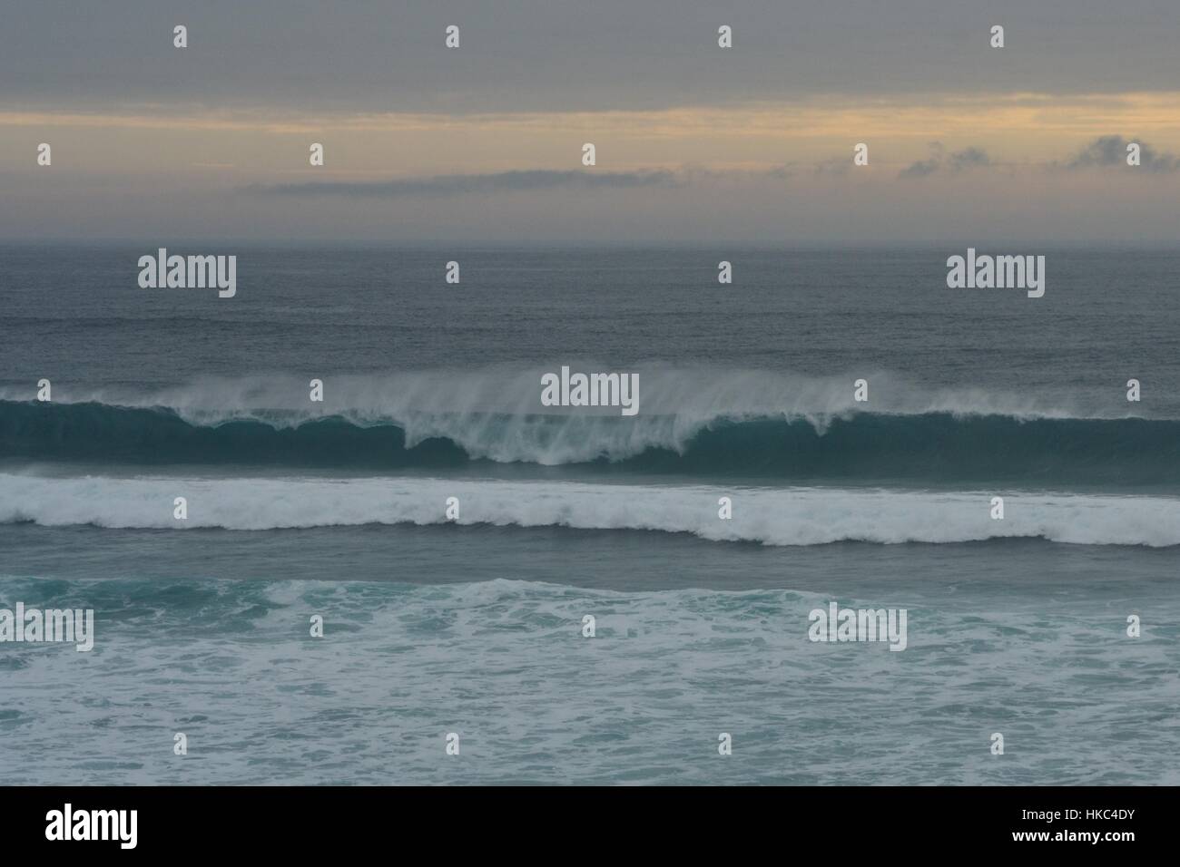 A perfect wave crashes on the beach at Sennen Cove, Cornwall on a ...