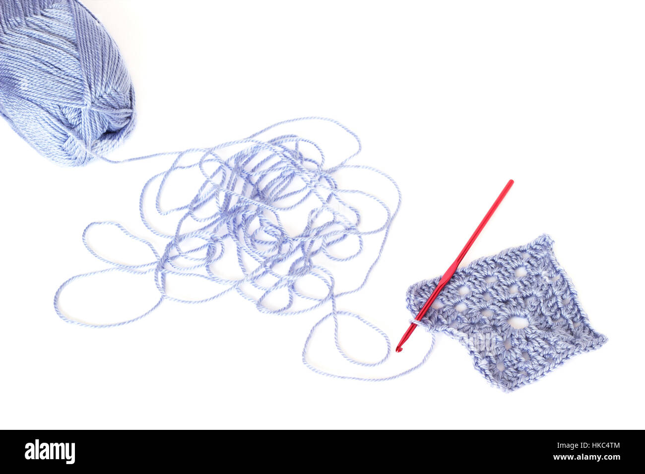 Light blue skein of acrylic thread with the unwound string, square ...