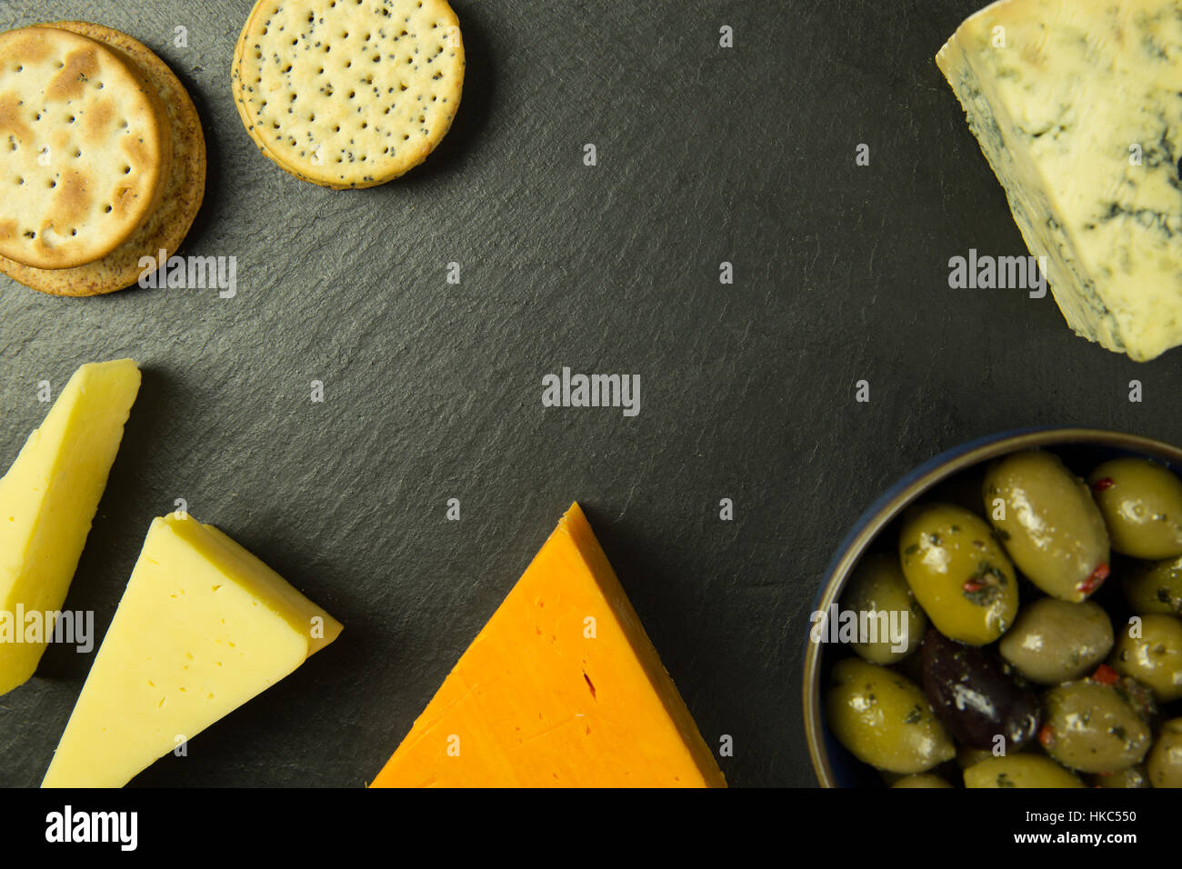 Cheese platter, olives and biscuits overhead Stock Photo - Alamy