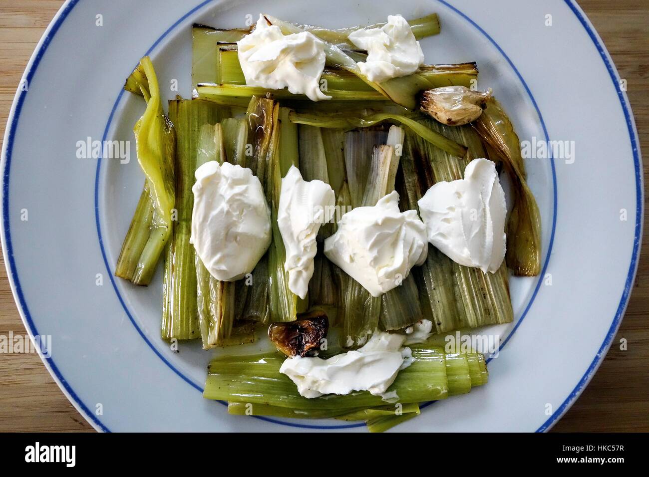 Baked Leeks with Cream Cheese and Garlic Stock Photo - Alamy