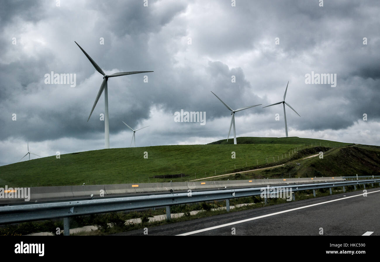 Wind Generators Turbines are generating electricity next to highway ...