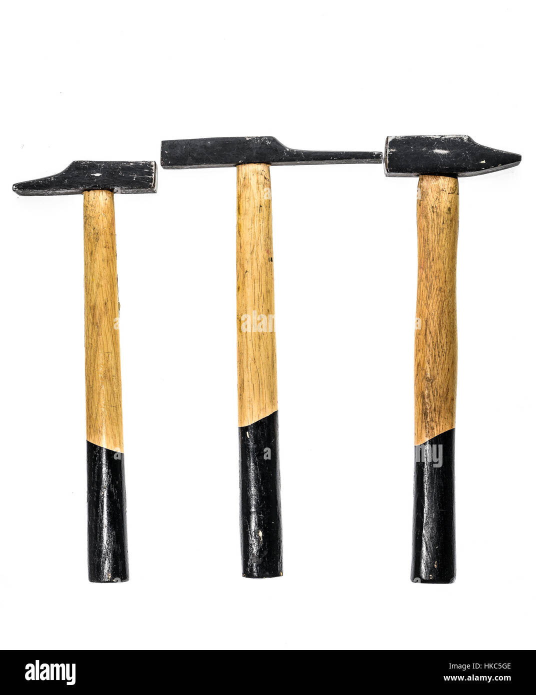 Three old, used hammer isolated on a white background. Black and yellow ...
