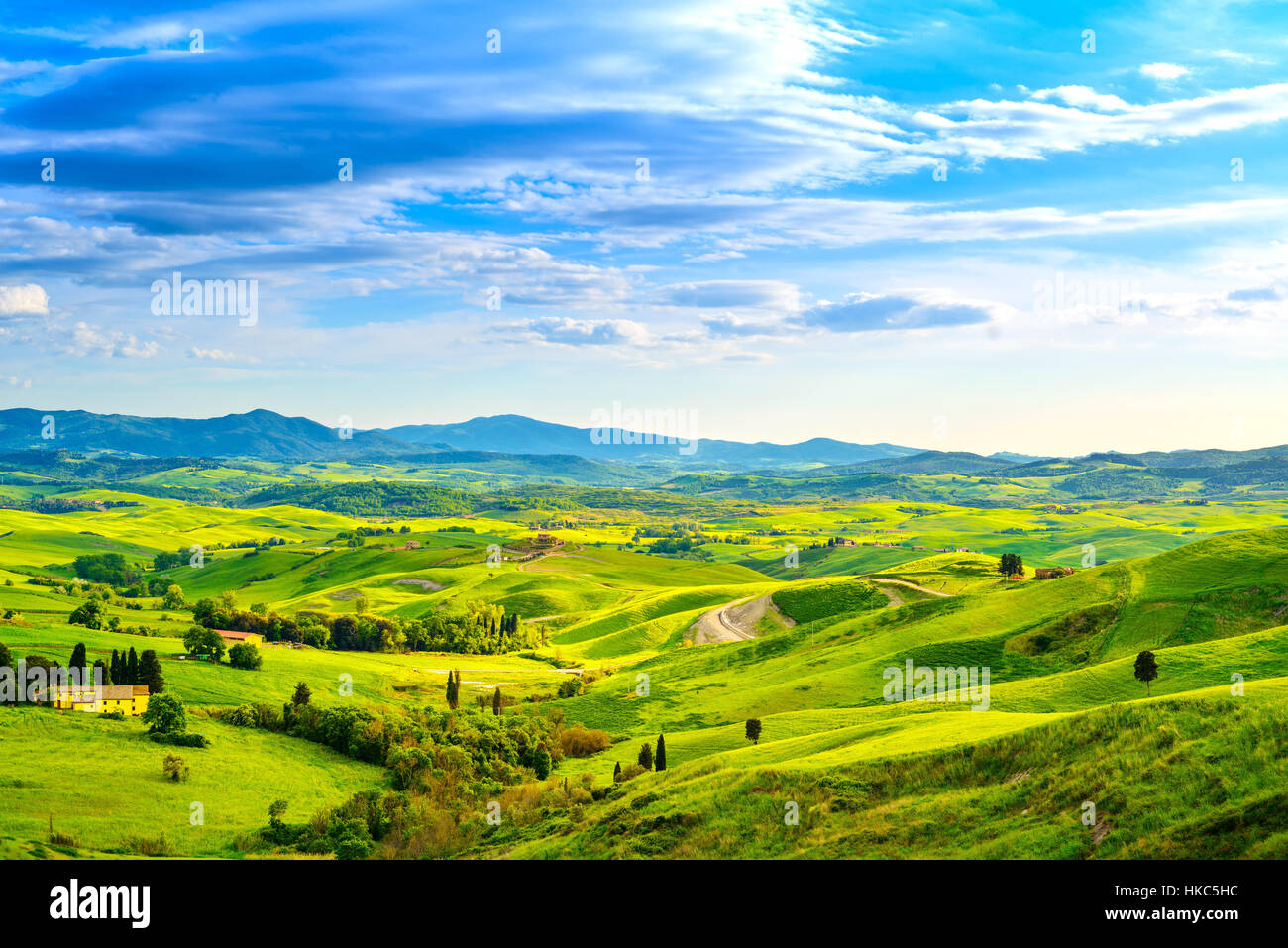 Tuscany, rural sunset landscape. Countryside farm, cypresses trees ...