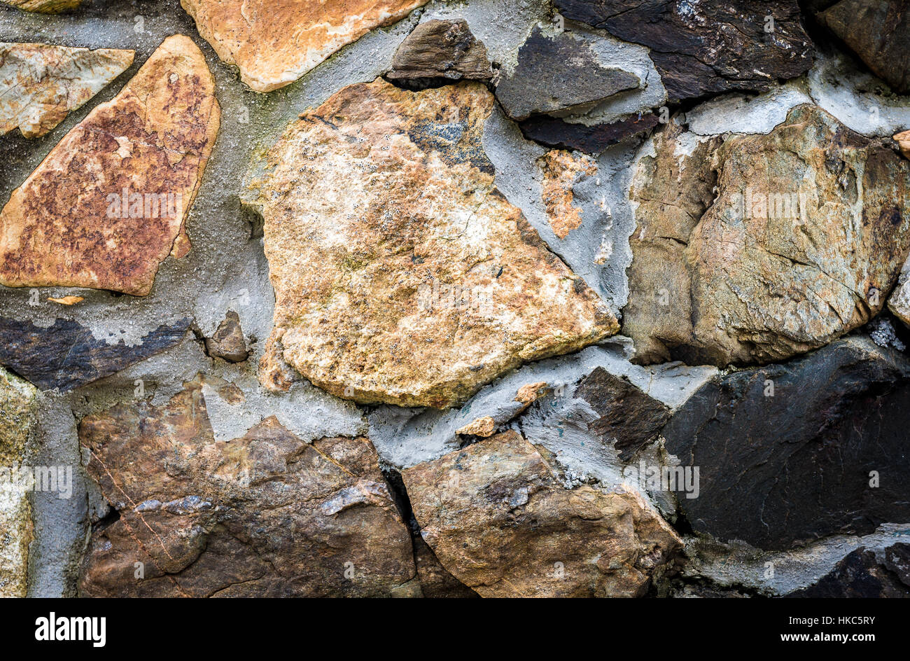 Authentic ancient Medieval stone wall texture. Rock pattern of color stones for modern or ...