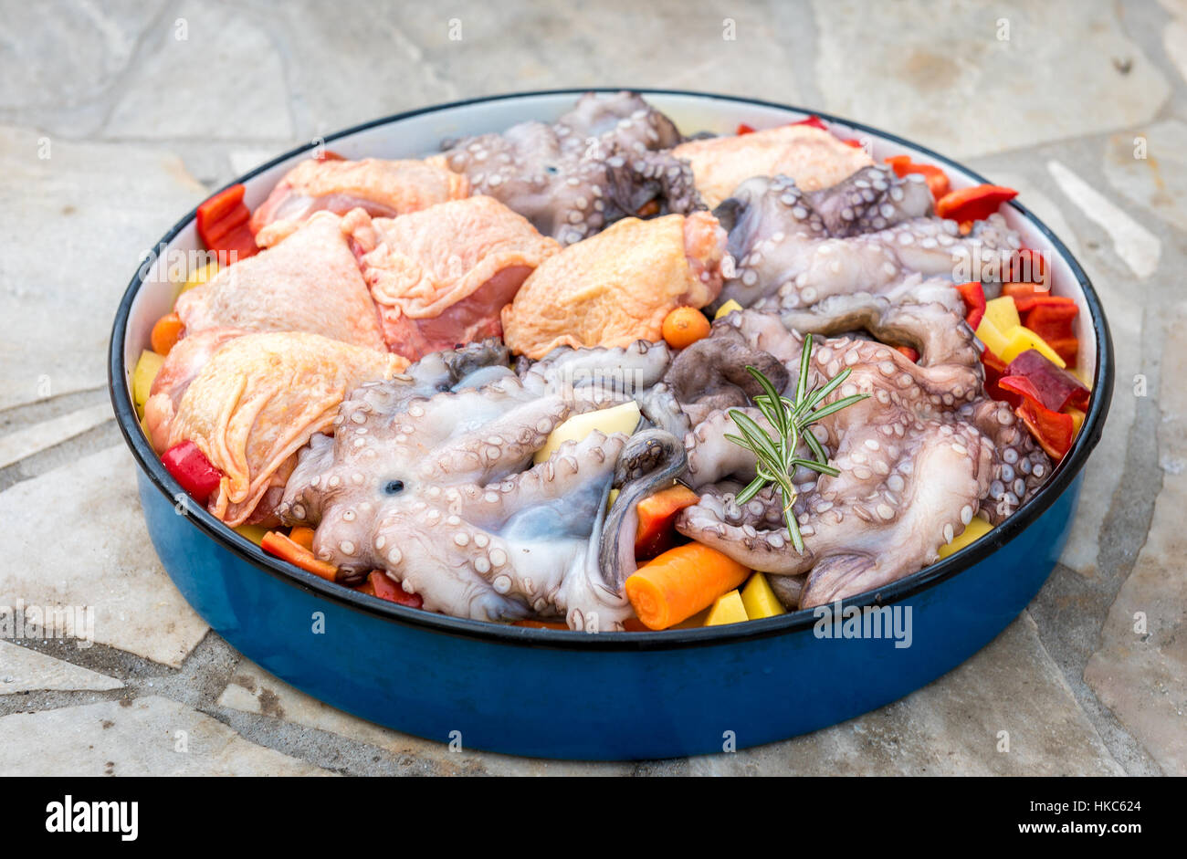 Preparing and Cooking of octopus and chicken in traditional Balkan ...