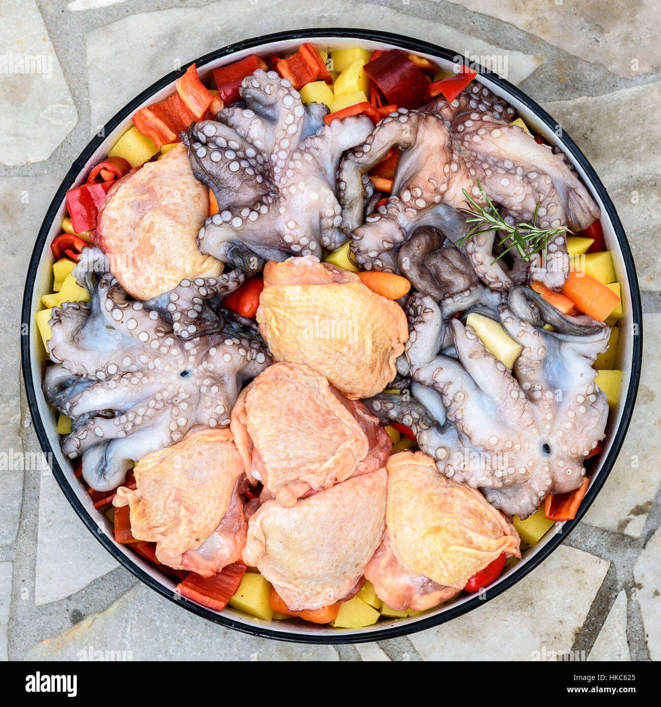 Preparing and Cooking of octopus and chicken in traditional Balkan ...