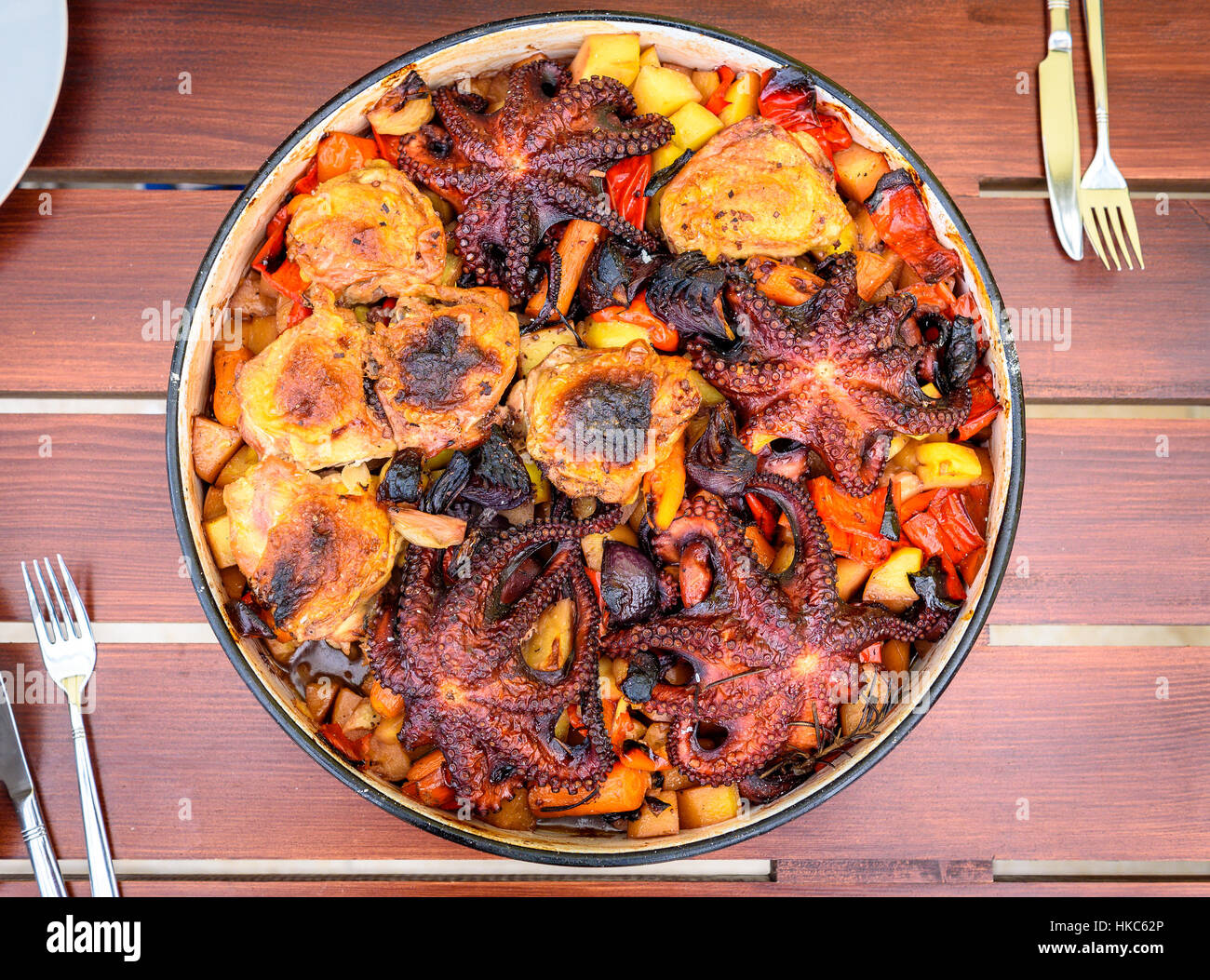 Preparing and Cooking of octopus and chicken in traditional Balkan ...