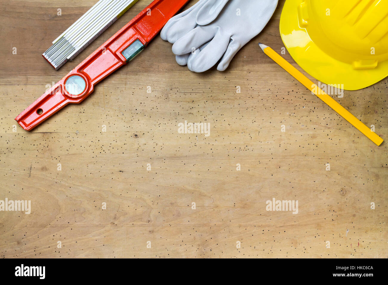 Protective helmet and mason tools on wood background Stock Photo - Alamy
