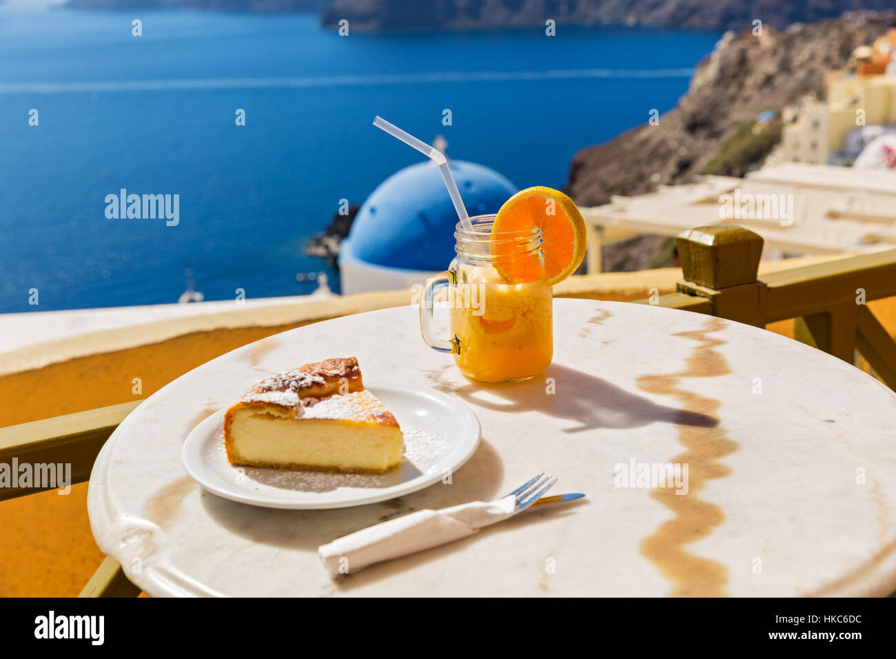 Orange juice and cheesecake on the beach Stock Photo - Alamy