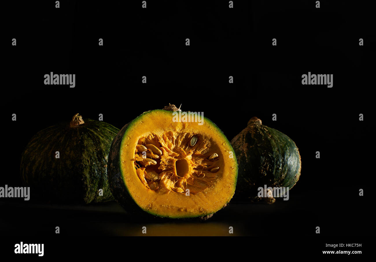 Kabocha squash, japanese pumpkin, over a black background Stock Photo ...