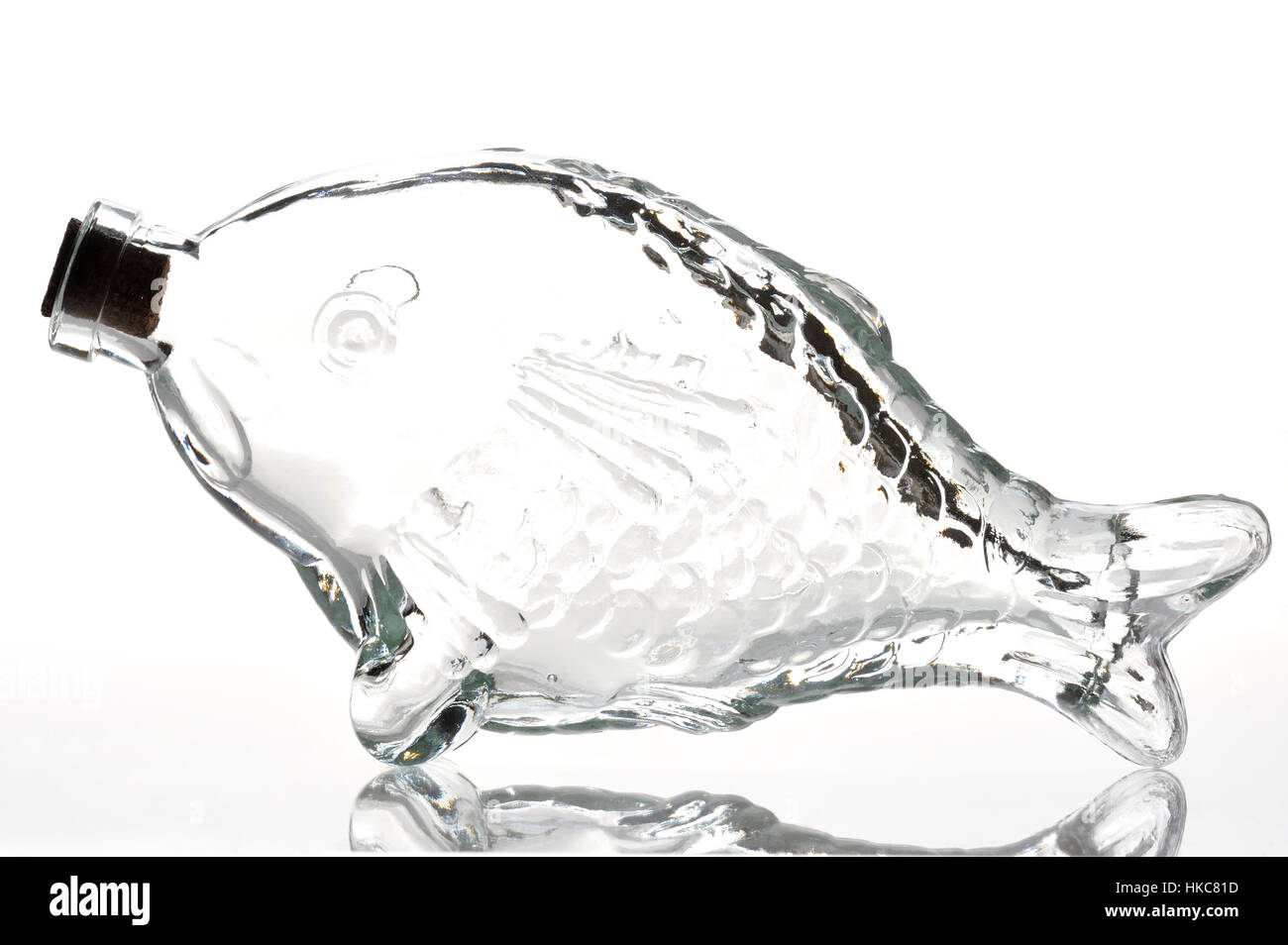 Empty fish shape bottle on a white background Stock Photo - Alamy