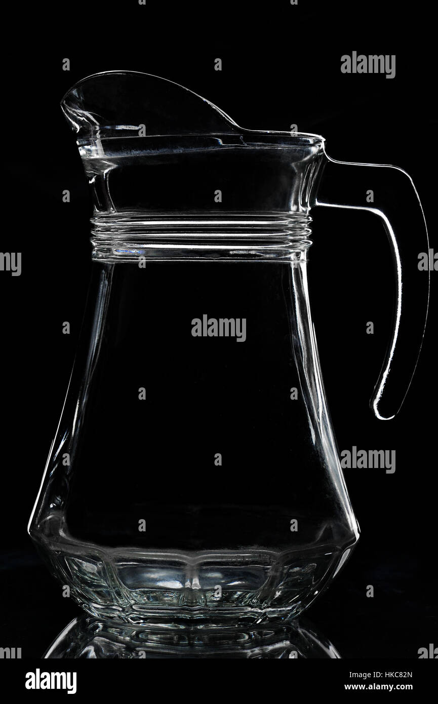 silhouette of empty jug on a black background Stock Photo - Alamy