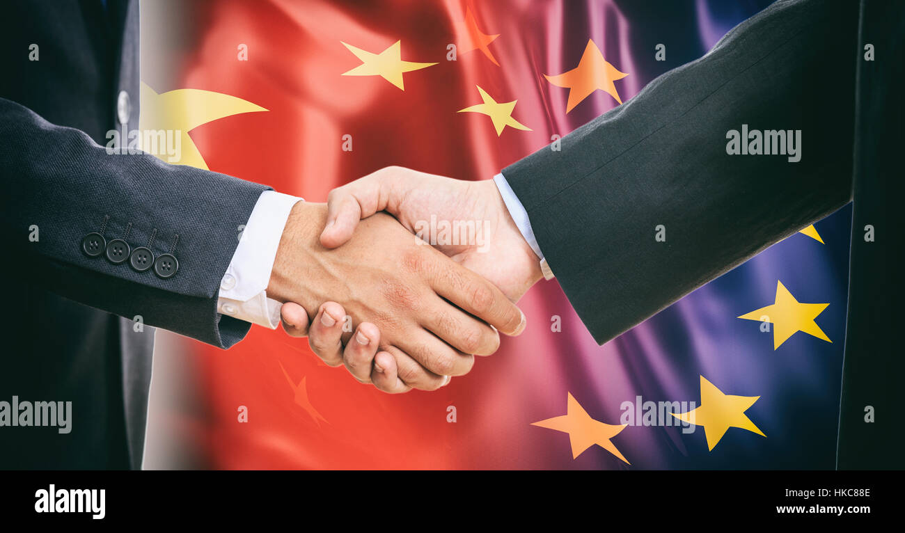 Formal handshake on EU - China flags background Stock Photo - Alamy