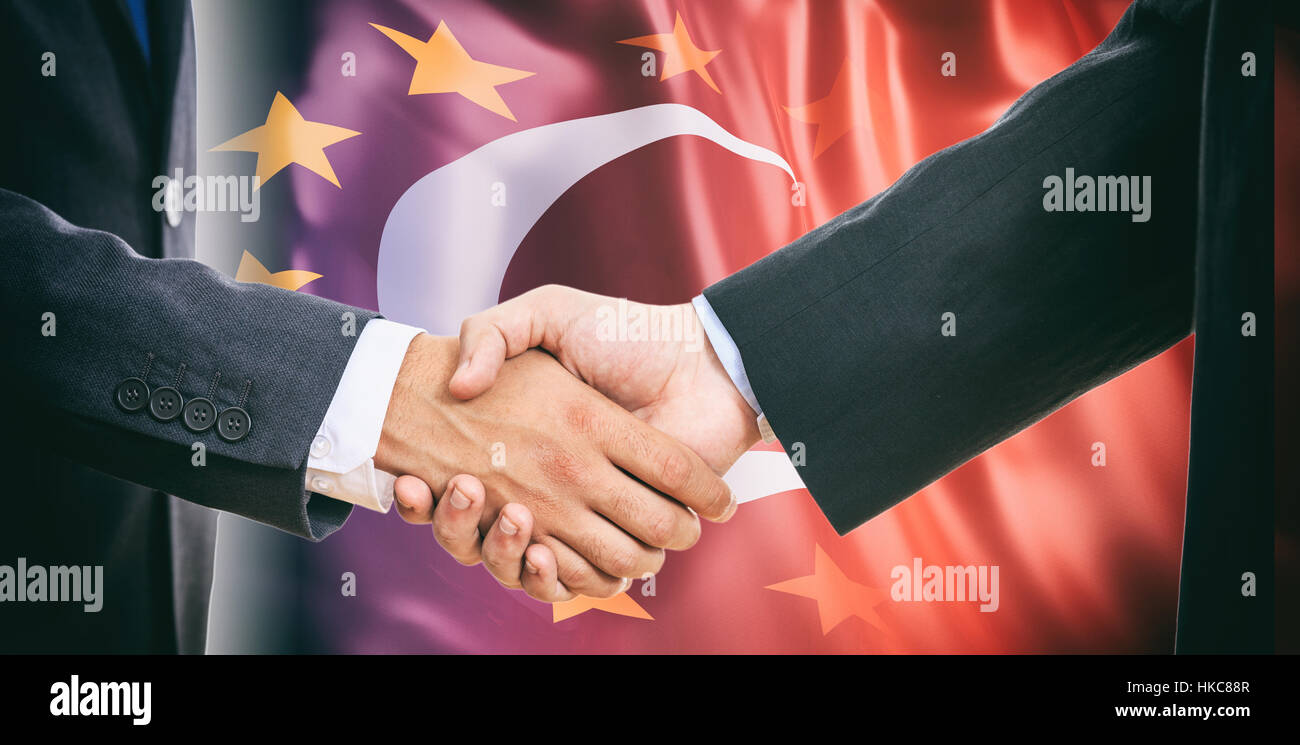 Formal handshake on EU - Turkey flags background Stock Photo - Alamy