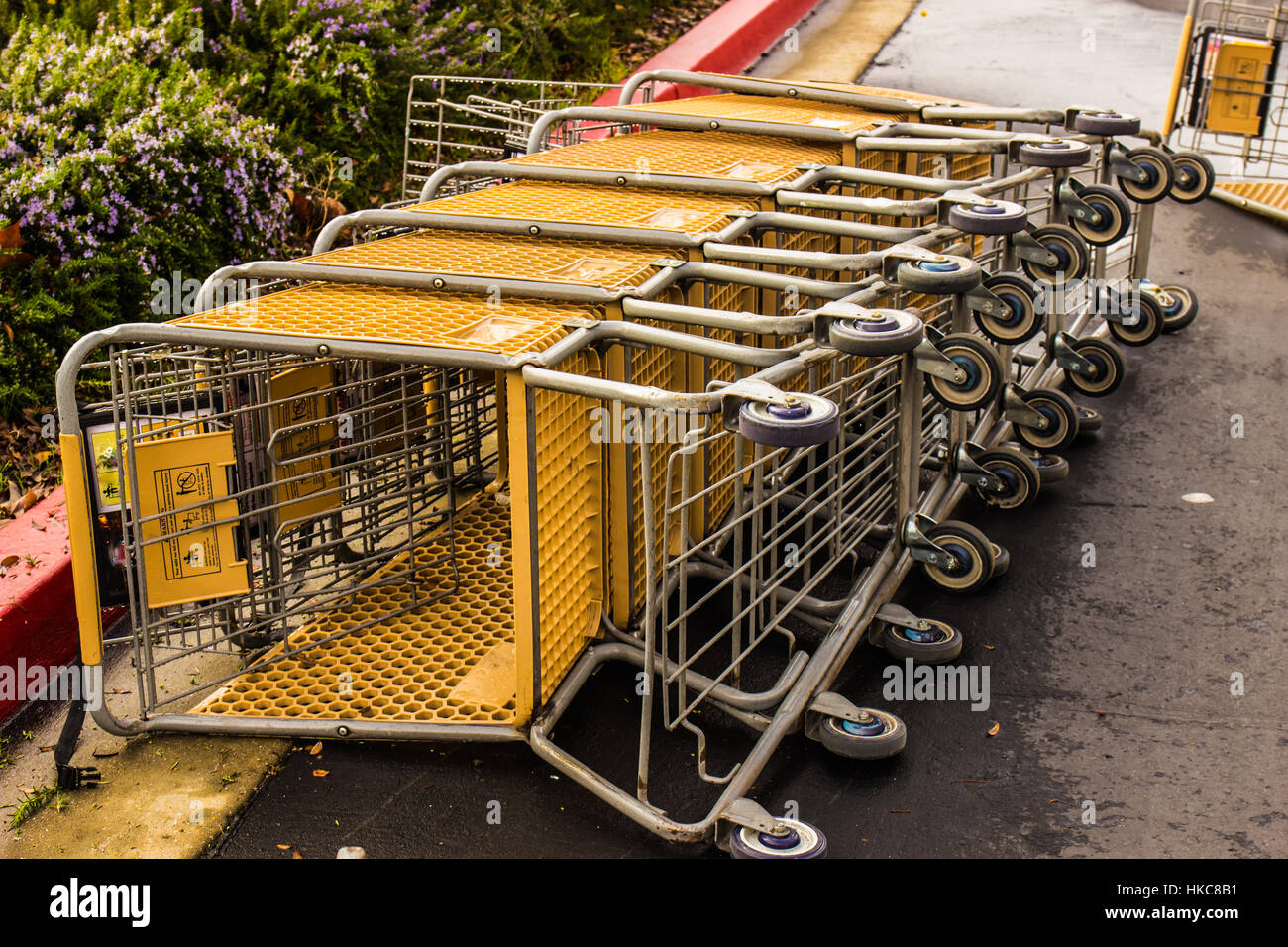 Row of Shopping Carts Tipped Over On Their Side Stock Photo - Alamy