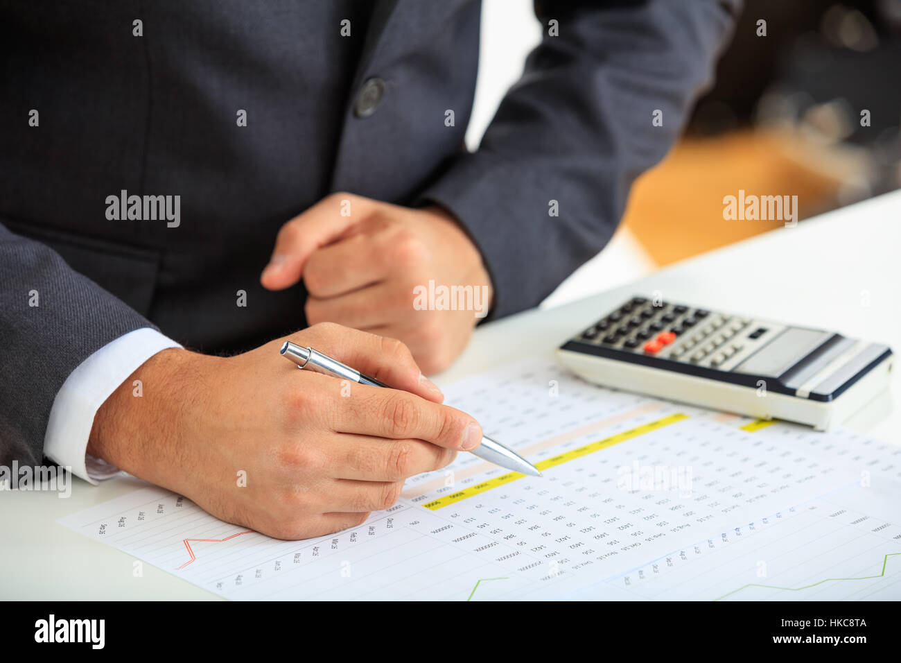 Manager looking at a data analysis report Stock Photo - Alamy
