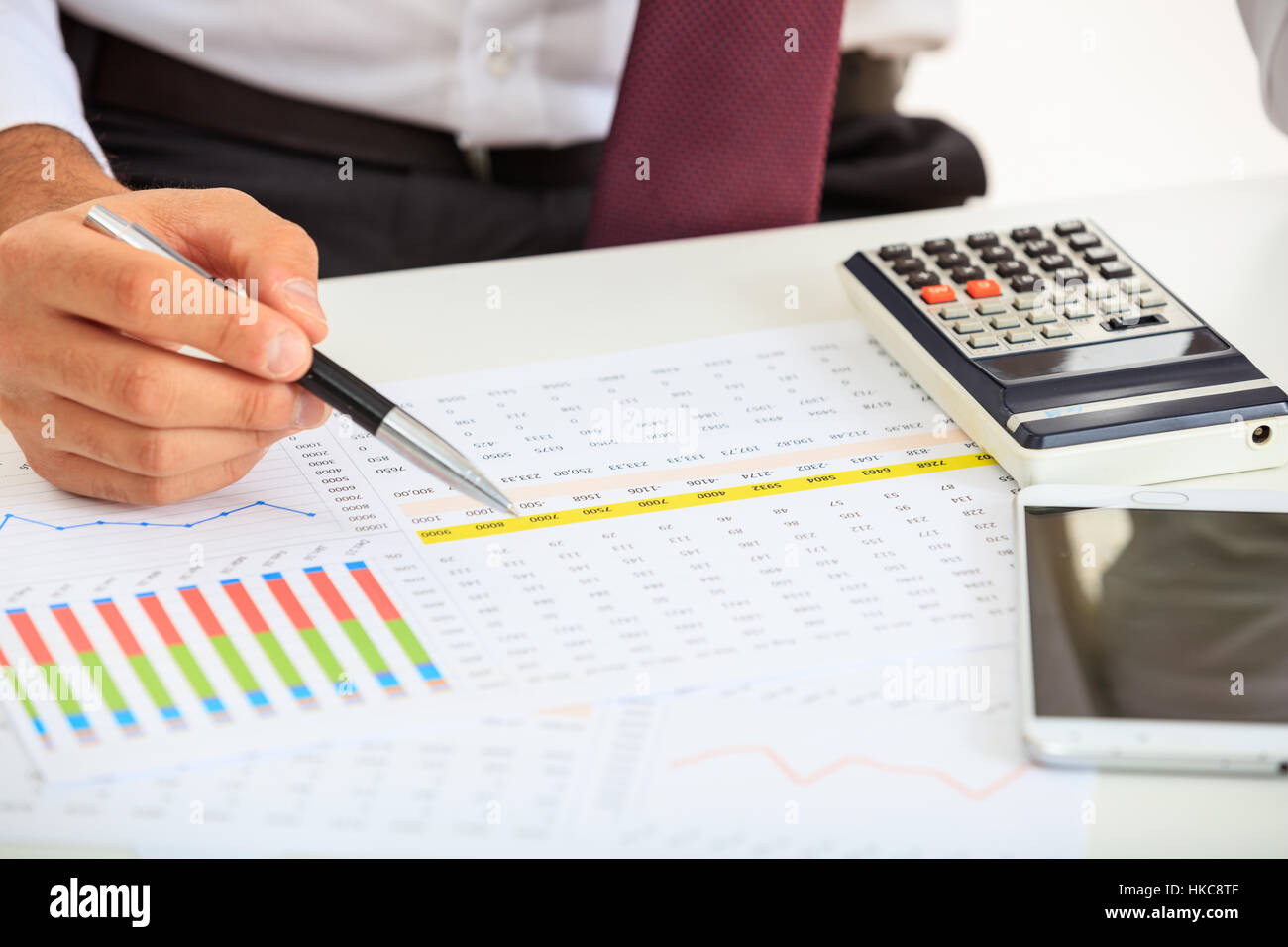 Manager looking at a data analysis report Stock Photo - Alamy