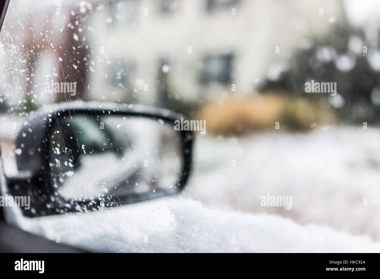 Snow covered car window glass view from inside with mirror Stock Photo ...