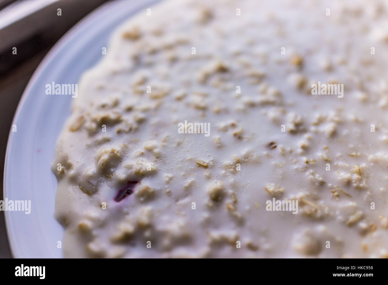 Macro closeup of plate of cooked oatmeal showing texture Stock Photo ...