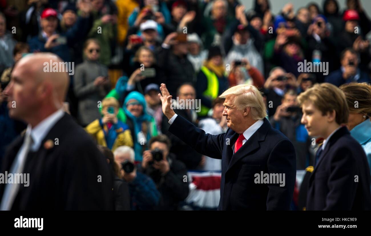 U.S. President Donald Trump waves at the crowd as he walks down ...