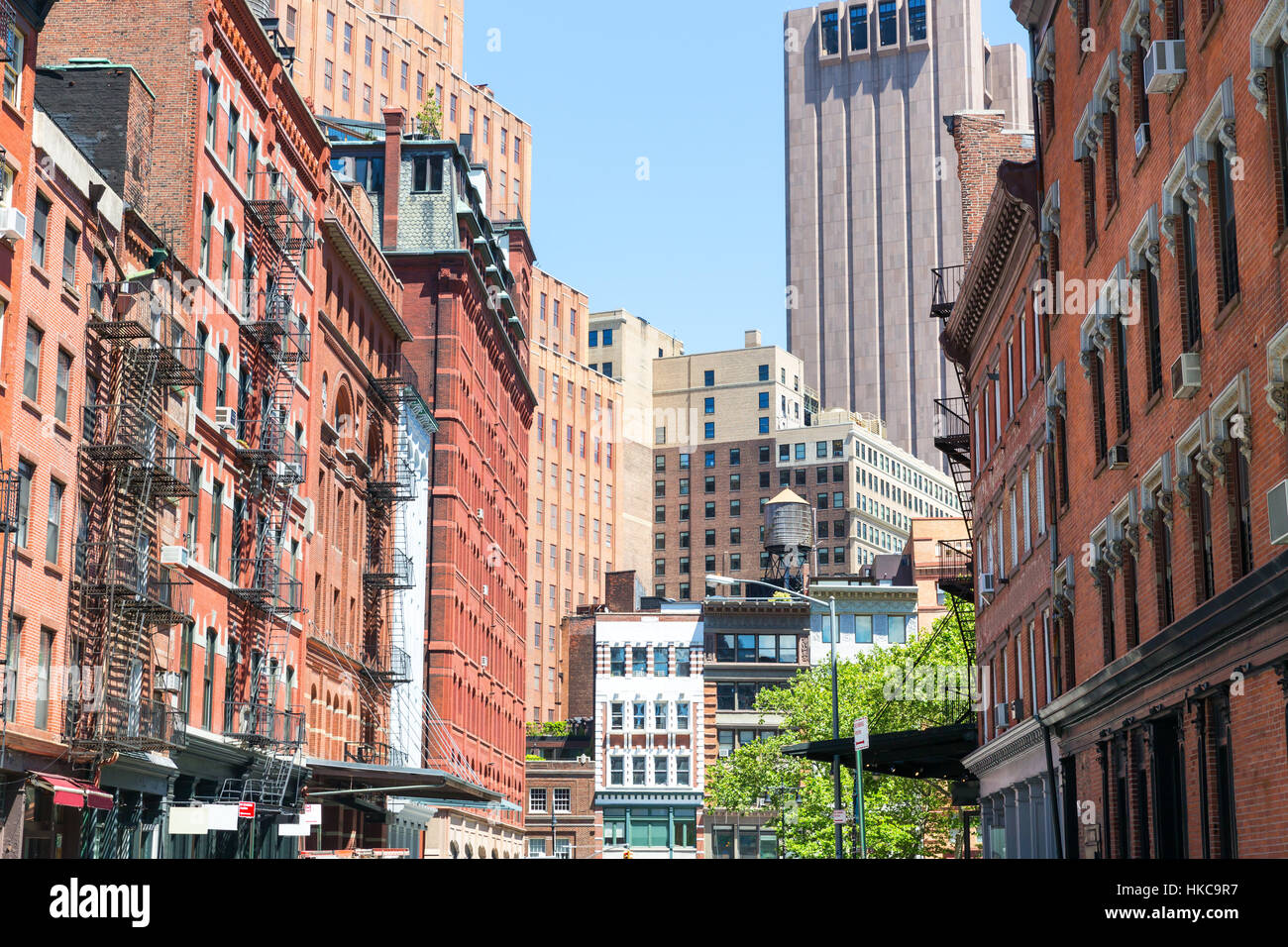Street with brick buildings and skyscraper Stock Photo - Alamy