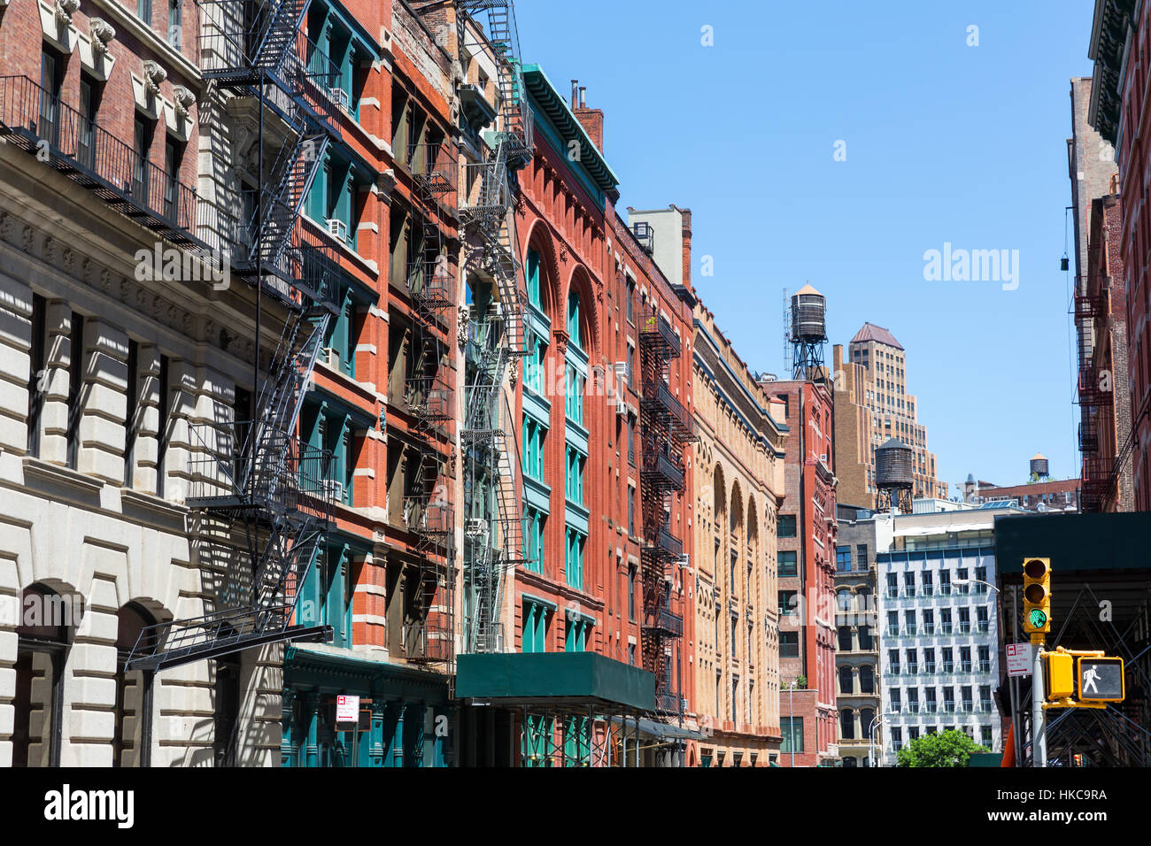 Street with brick buildings and skyscraper Stock Photo - Alamy