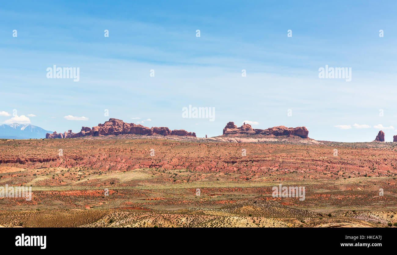 Landscape of valley against red rocky mountains Stock Photo - Alamy