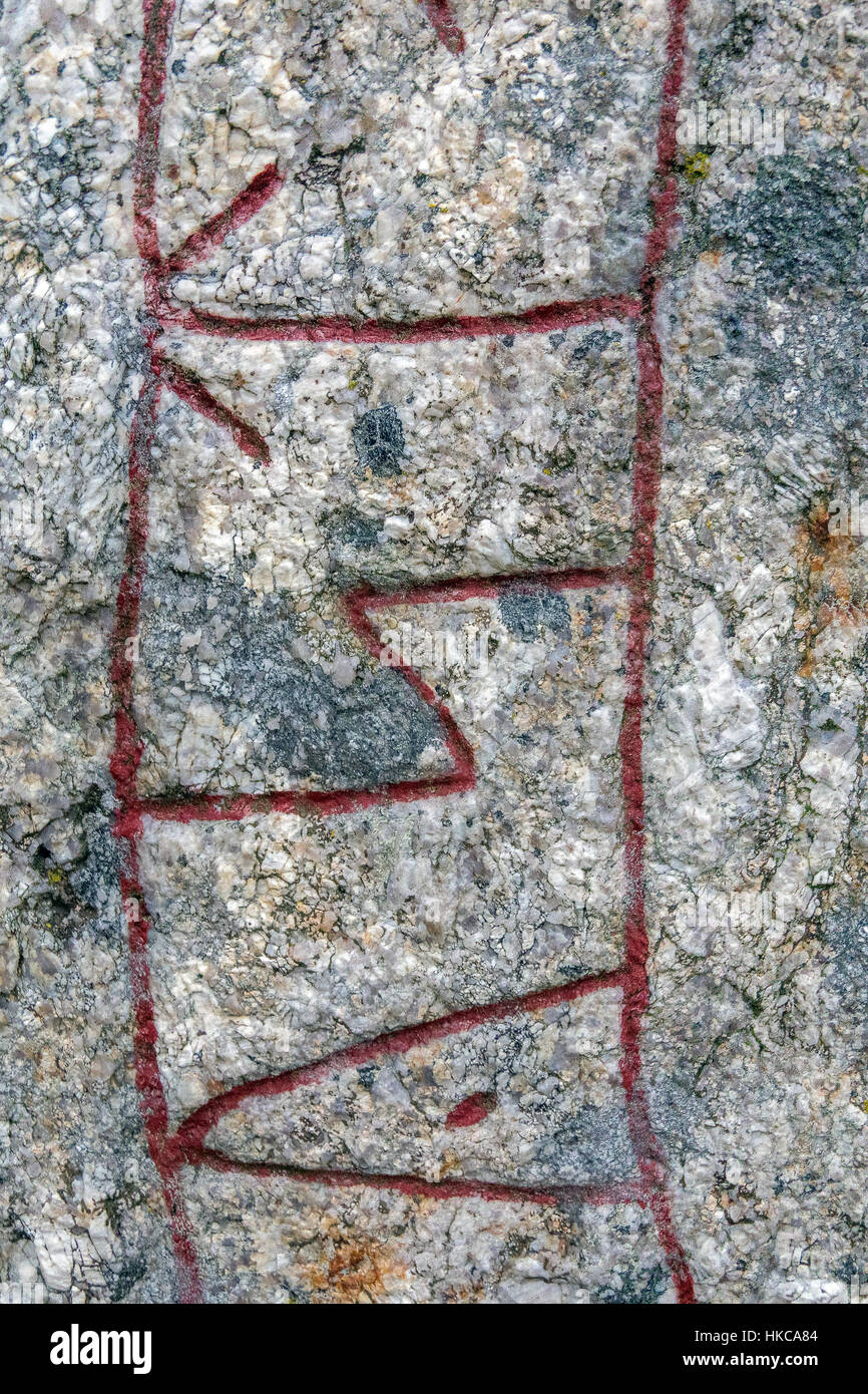 Runestone on a the field with runic inscription, runes about 1000 A.D ...