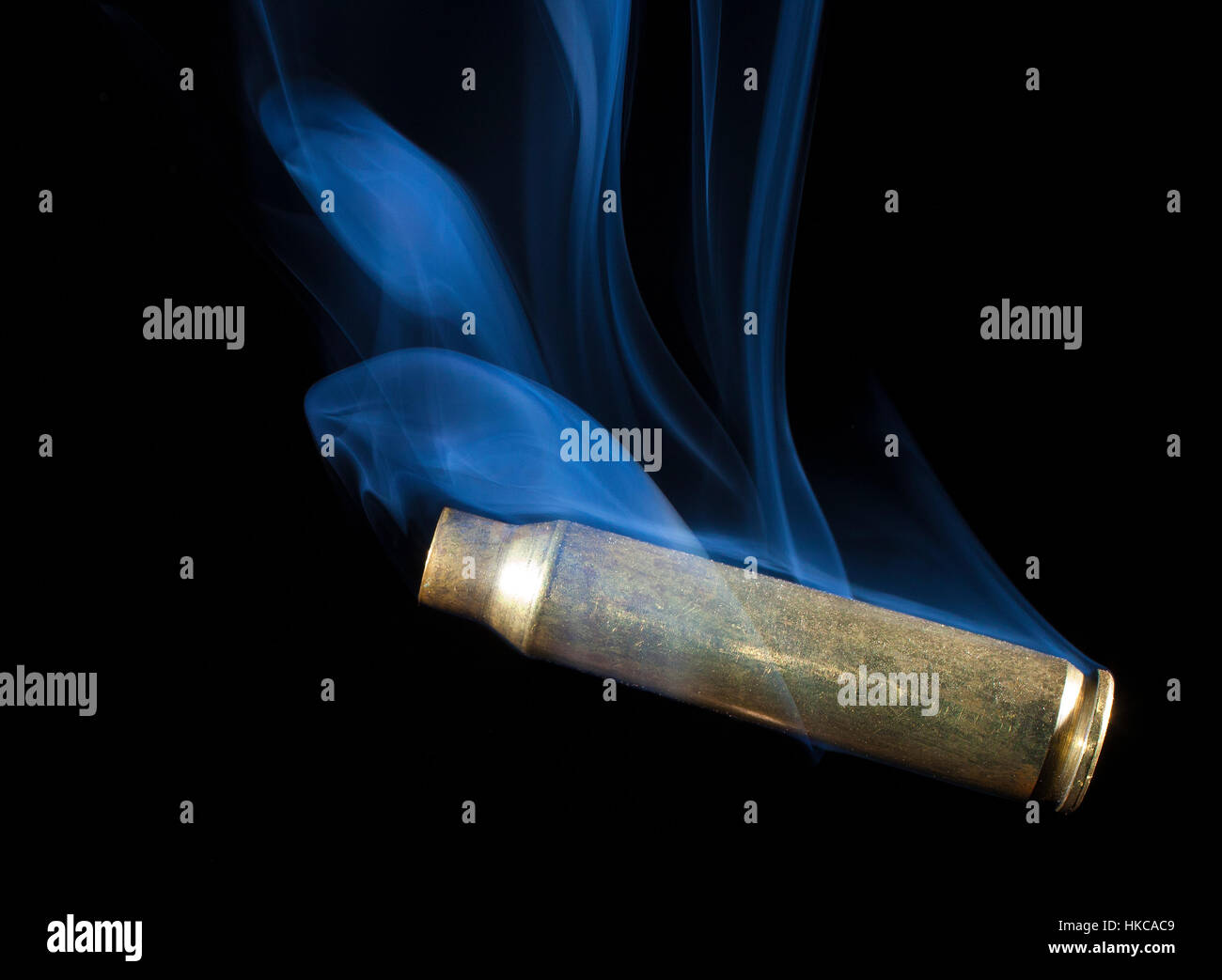 Casing from a rifle cartridge that has been shot and has smoke Stock ...