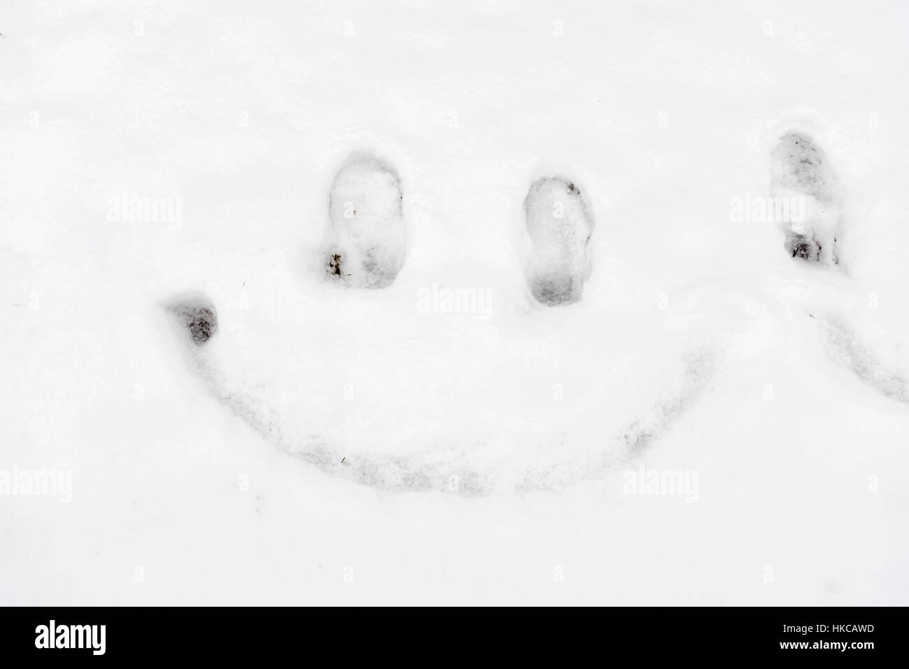 Smiley has been made in the snow Stock Photo - Alamy