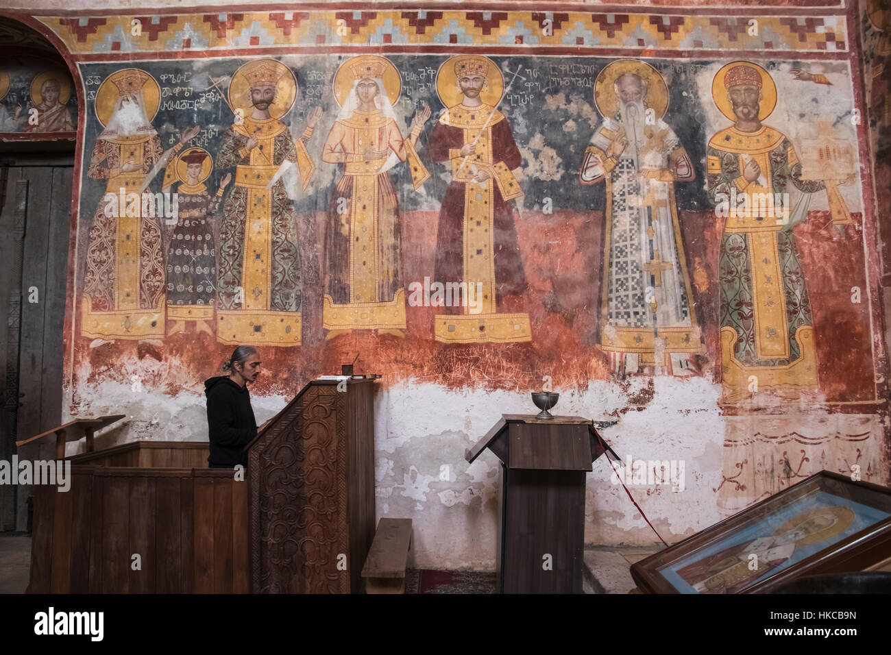 Priest Praying By The Mural Fresco On The North Wall Of The Church Of ...