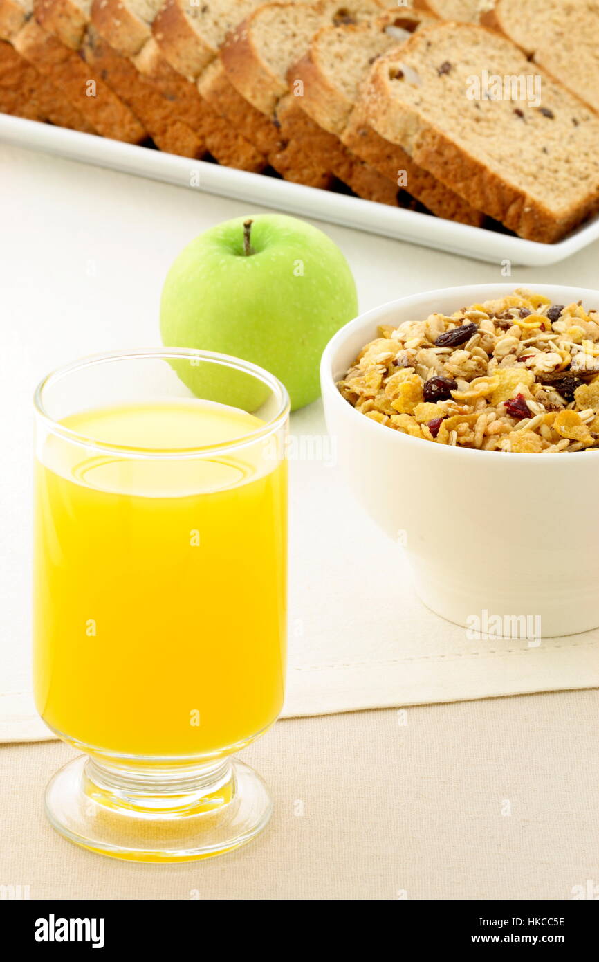 delicious breakfast with orange juice, whole grain bread,fresh apple ...