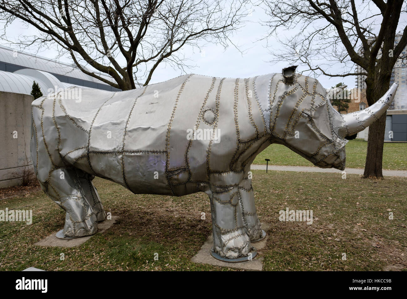 Aluminum sculpture of a white rhino by artist Tom Benner in front of ...