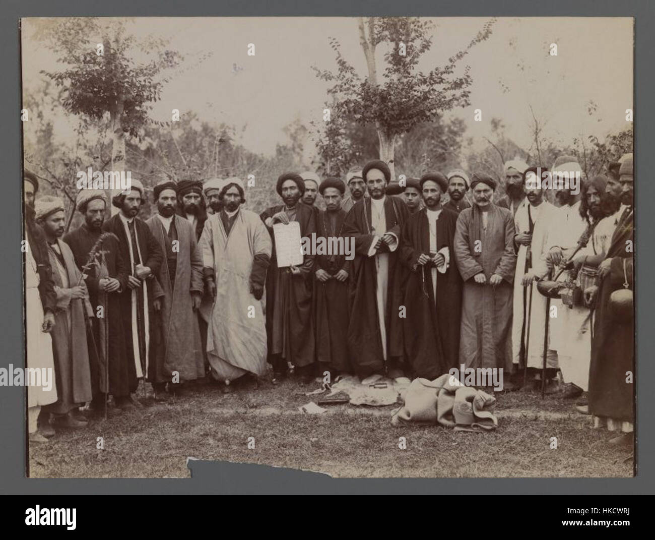 A vintage photograph of a group of religious men dressed in traditional ...