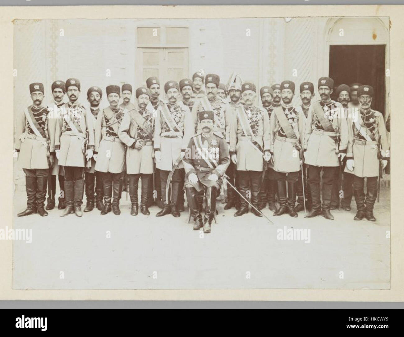 This vintage photograph shows a military officer with his regiment in a ...