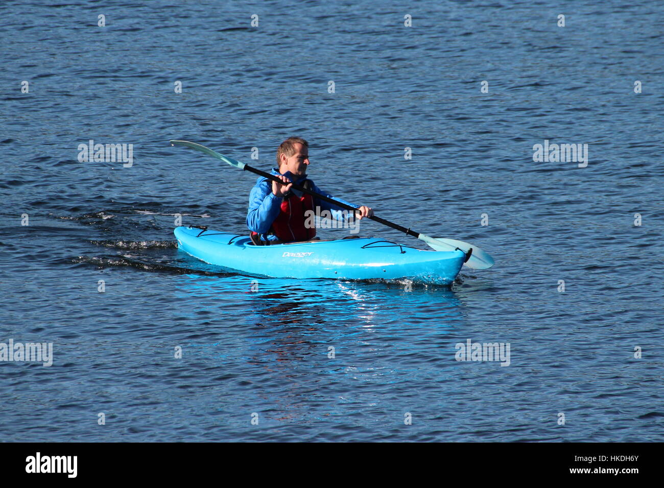A kayaker in a blue Dagger Zydeco kayak, enjoying the waters of the ...