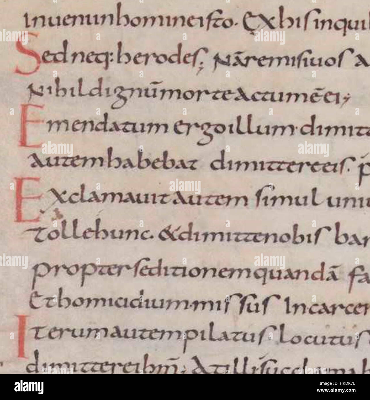 The 'Minuscule Caroline' depicts a medieval manuscript script ...