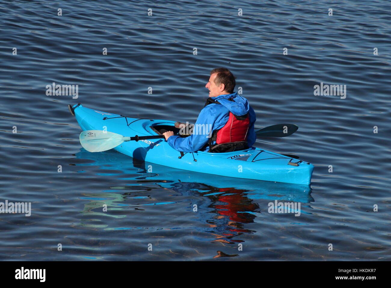 A kayaker in a blue Dagger Zydeco kayak, enjoying the waters of the ...
