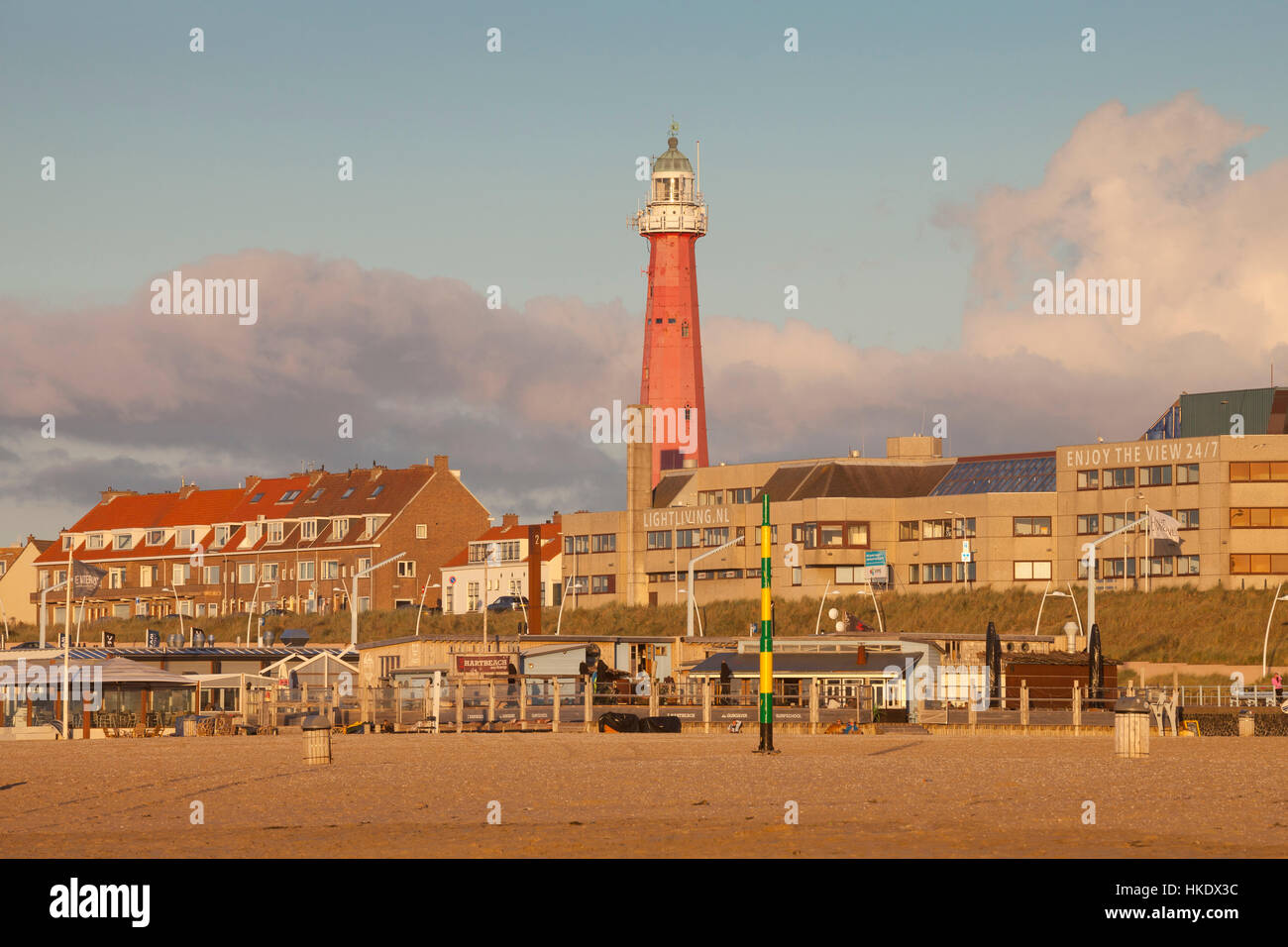 Lighthouse on beach behind buildings, Scheveningen, The Hague, Holland ...
