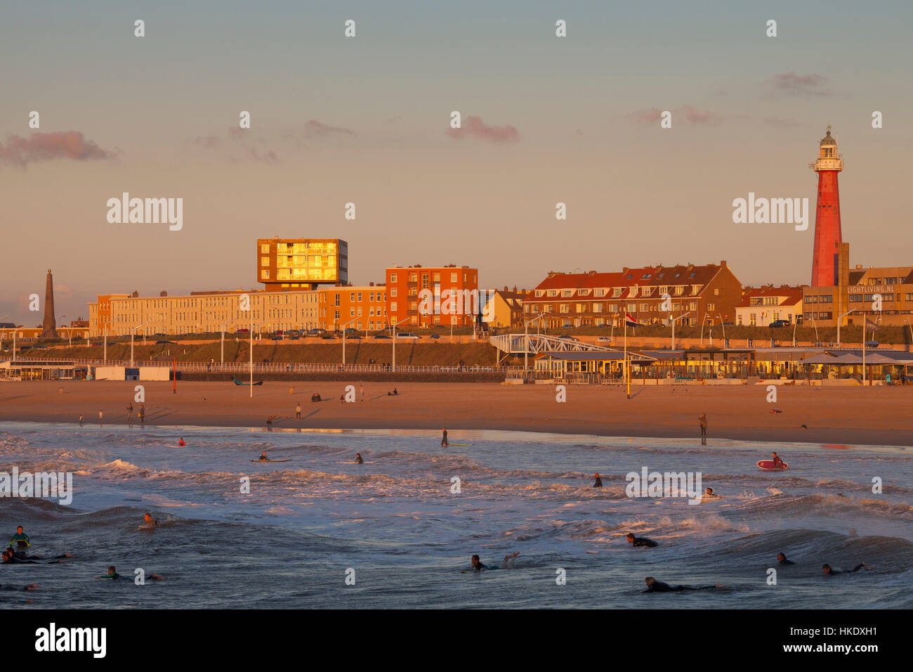 Lighthouse on beach behind buildings, Scheveningen, The Hague, Holland ...