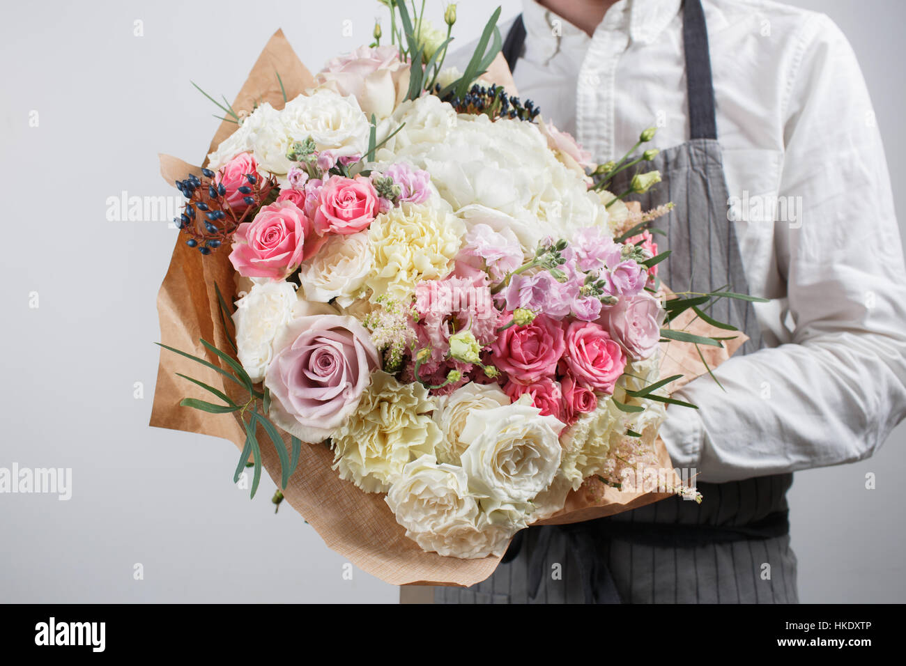 beautiful bouquet made of different flowers in young man hand ...